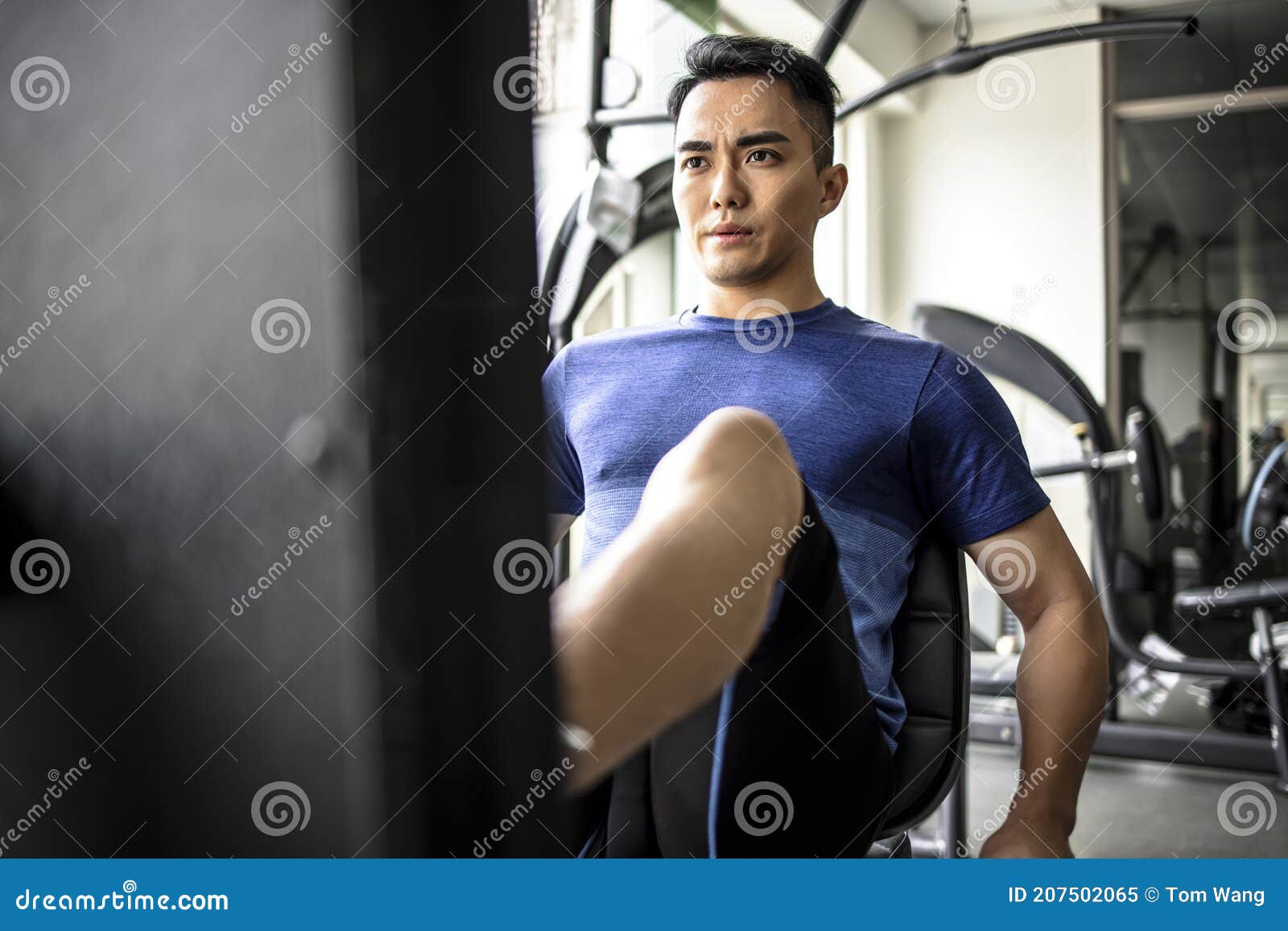 Asian Young Man Doing Leg Presses in Gym Stock Image - Image of focused ...