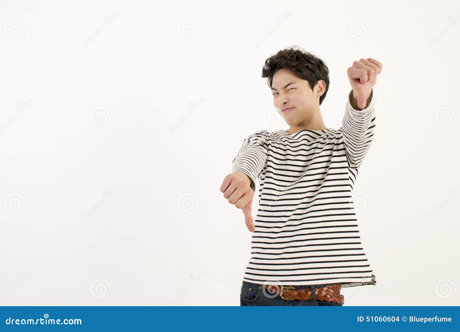 Asian Young Man Giving Two Thumbs Down Stock Photo - Image of chinese ...