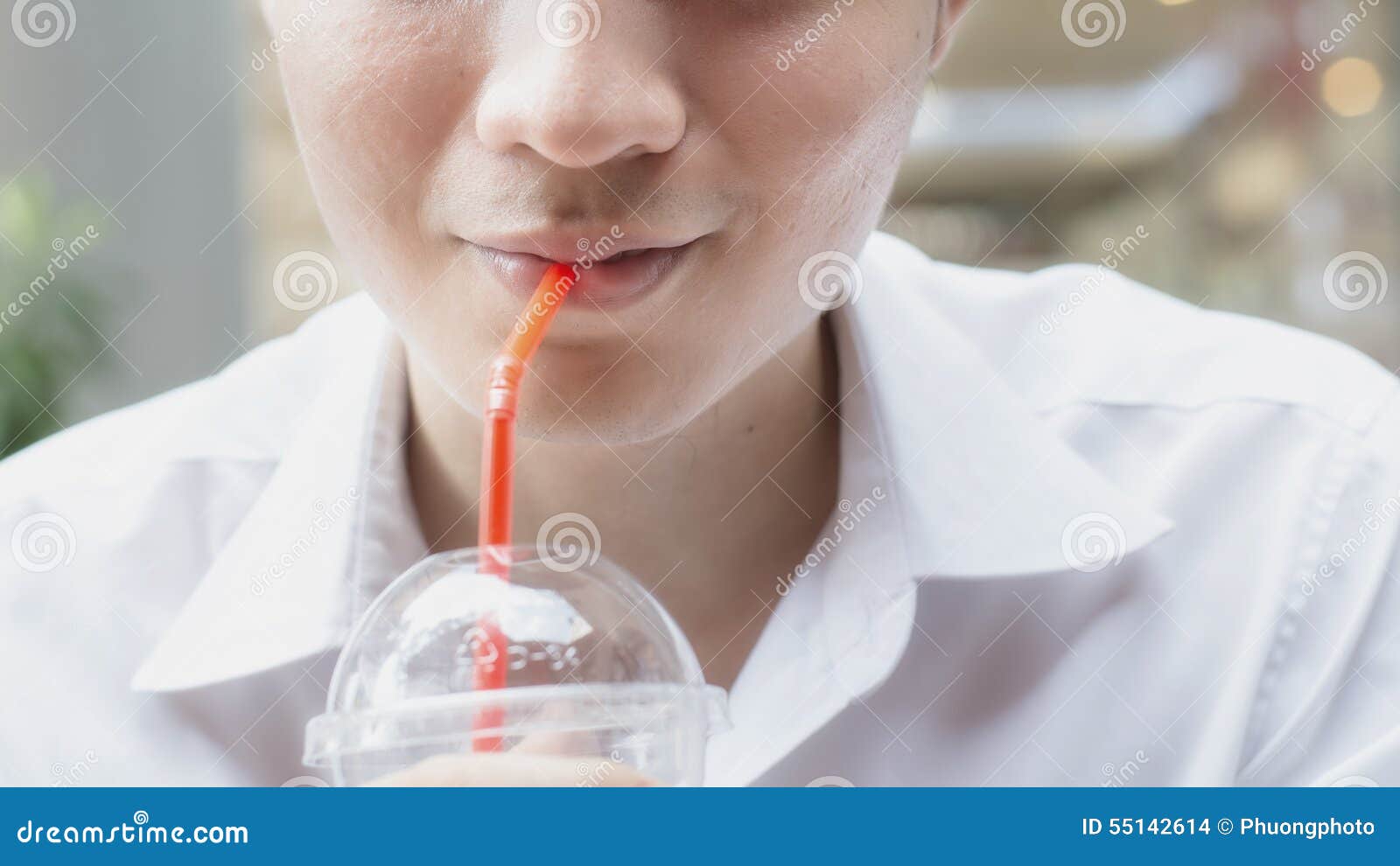 Asian Young Man Using a Straw To Drink Stock Photo - Image of black ...
