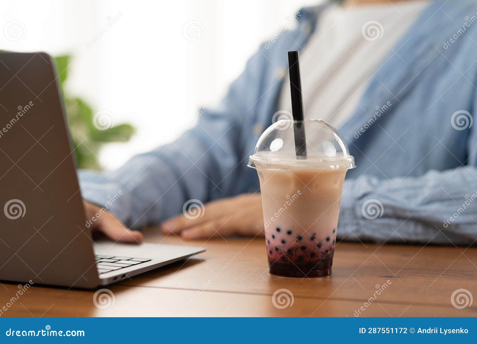 Asian Young Man Working Use Laptop Computer and Drink Bubble Tea in ...
