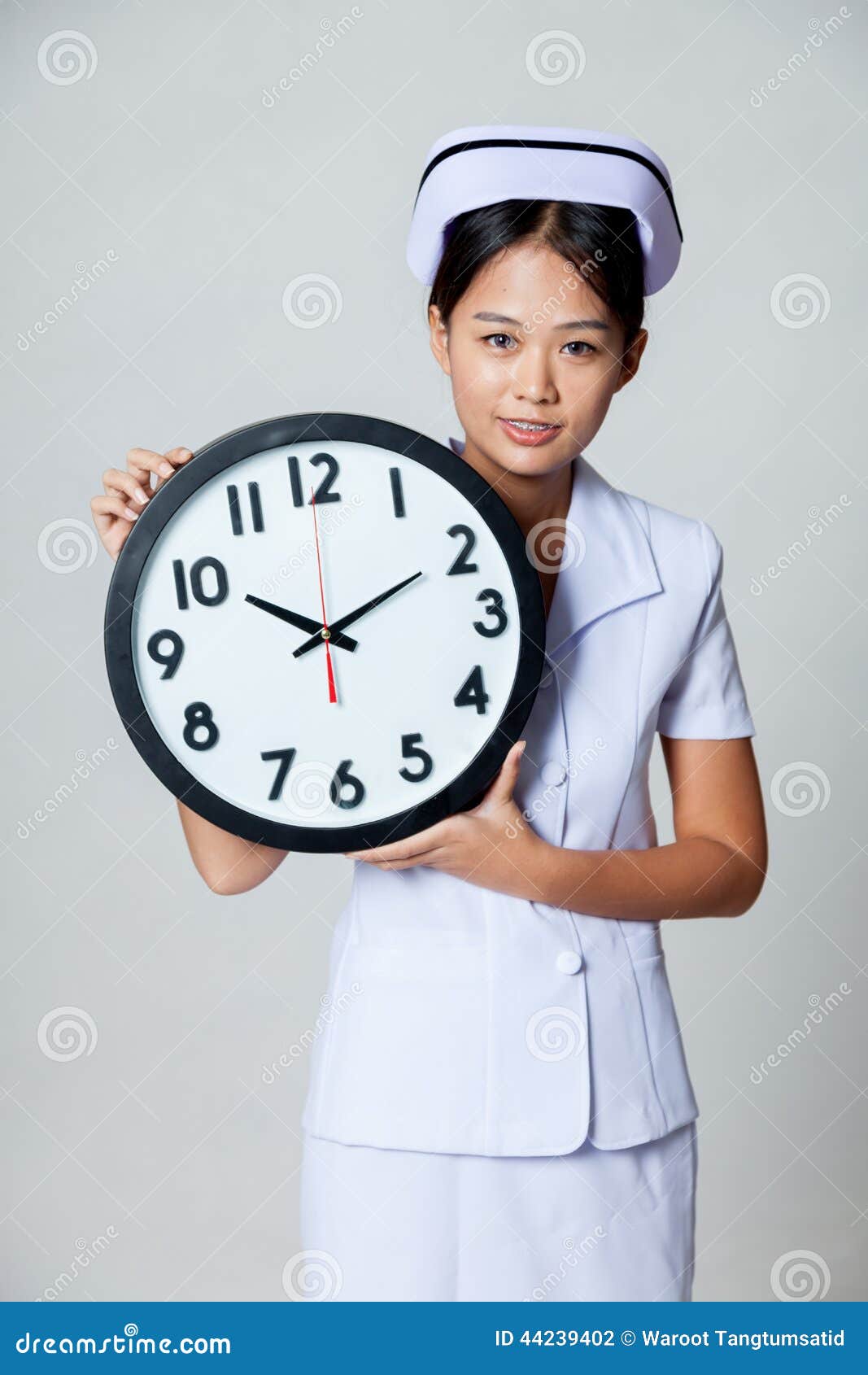 Asian Young Nurse with a Clock Stock Photo - Image of appointment ...