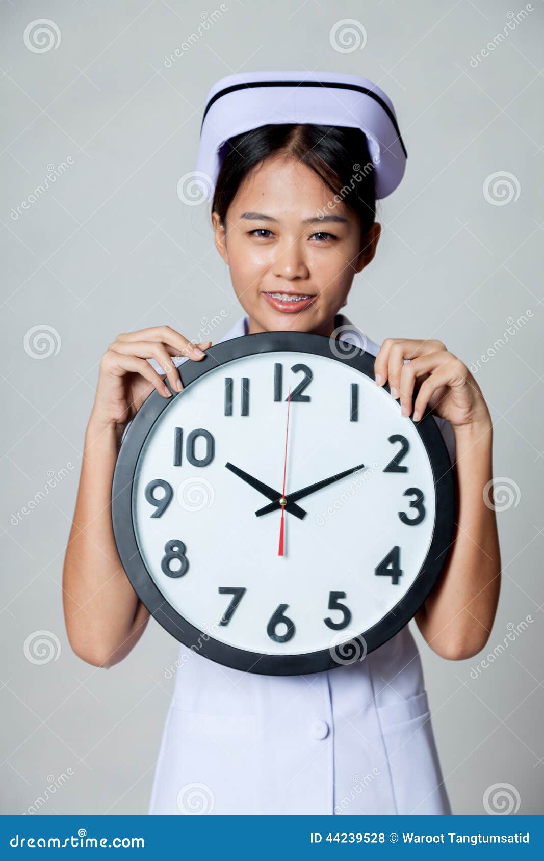 Asian Young Nurse Smile Clock Stock Photos - Free & Royalty-Free Stock ...