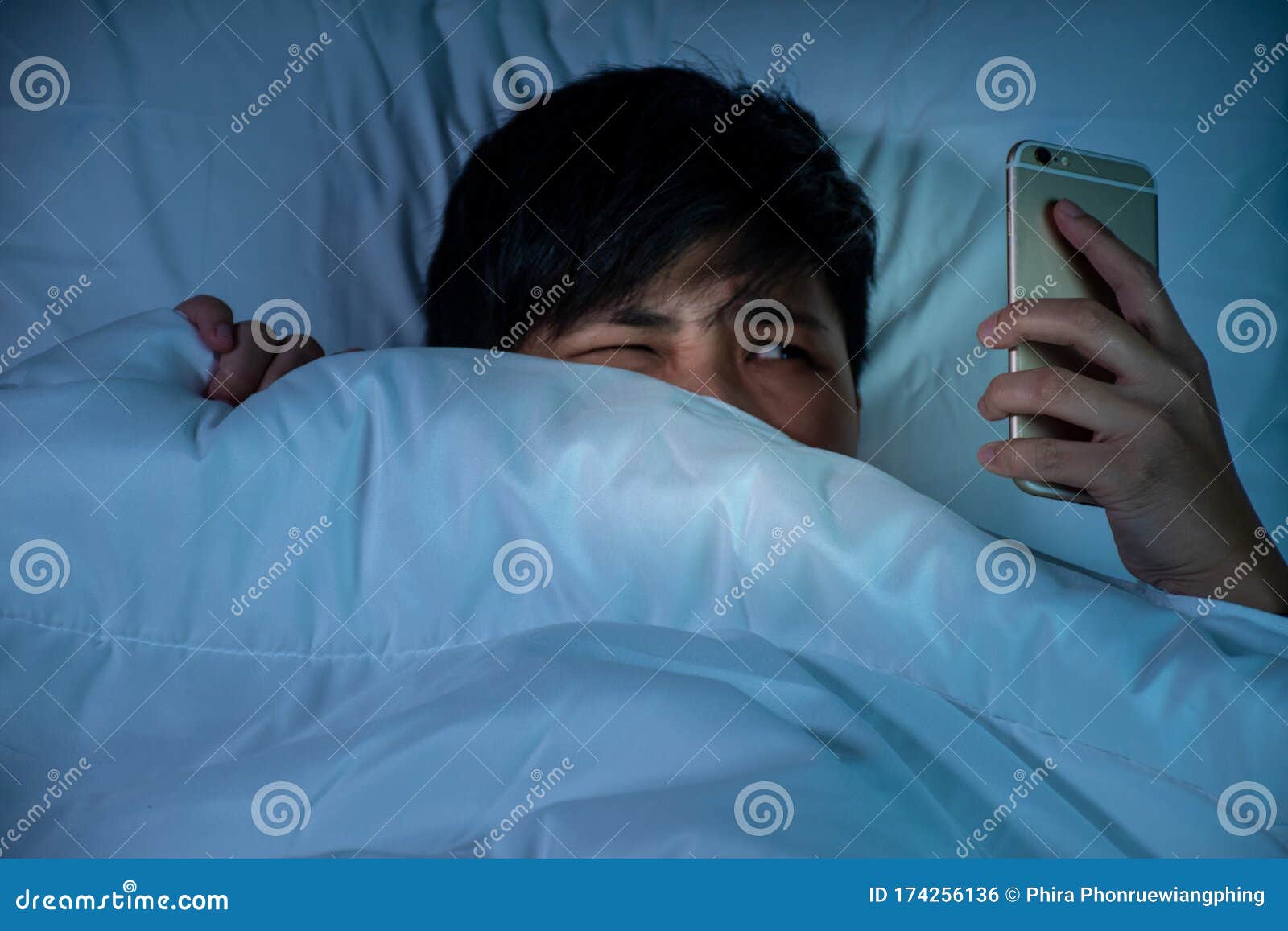 Asian Young People Using Smartphones in Bed at Night Stock Photo ...