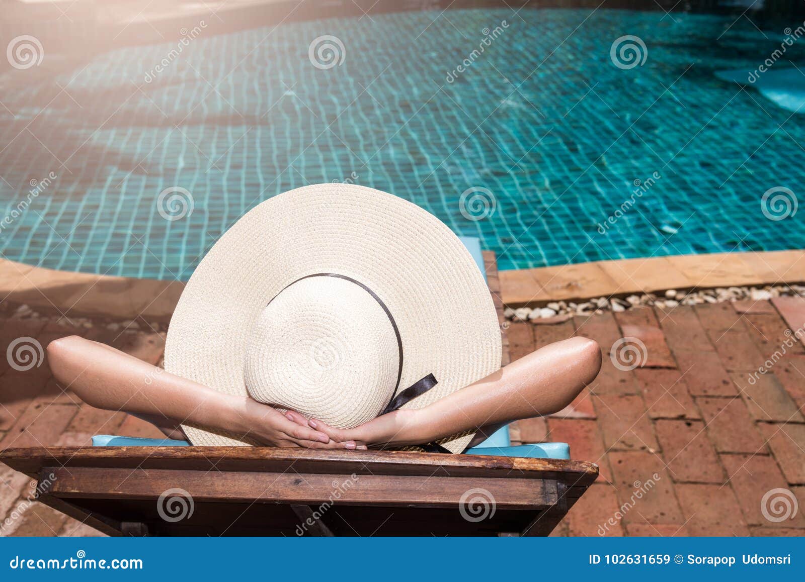 Asian Young Women Relaxing Sleep Poolside At Luxury Swimming Poo Stock