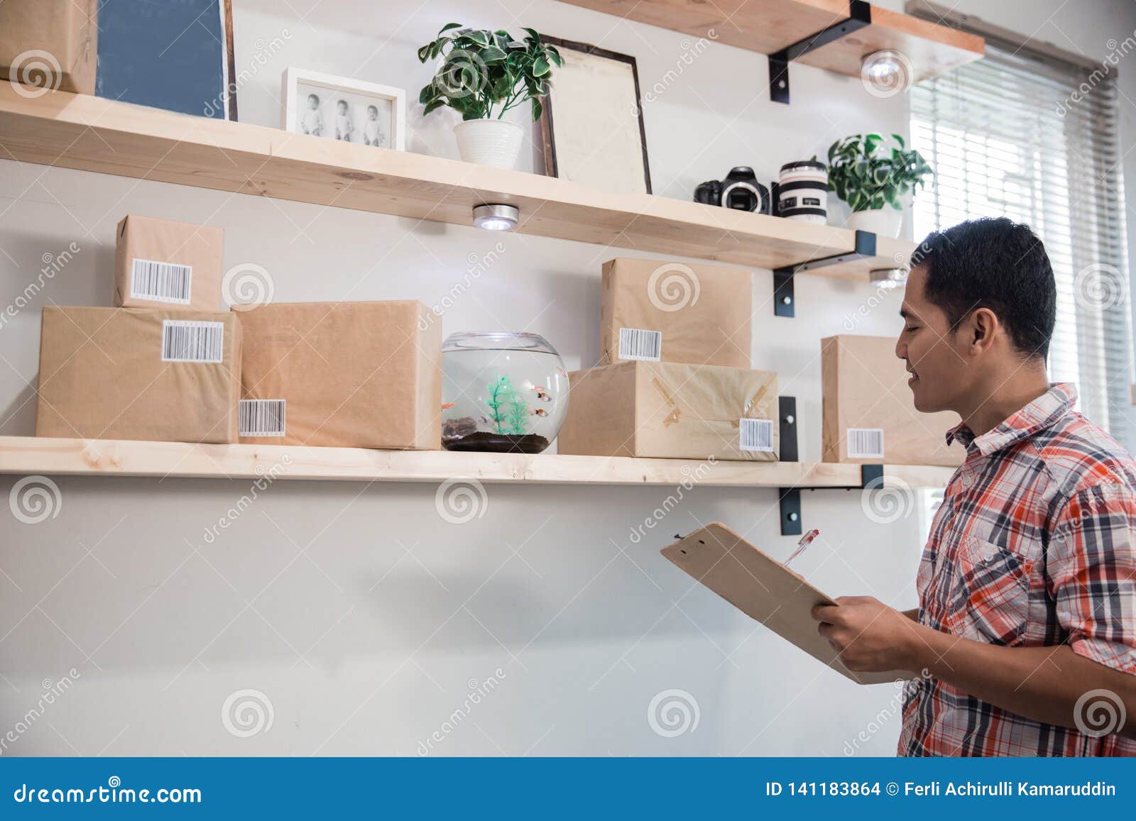 Asian Young Worker Look at Boxes To Checking Item Stock Photo - Image ...