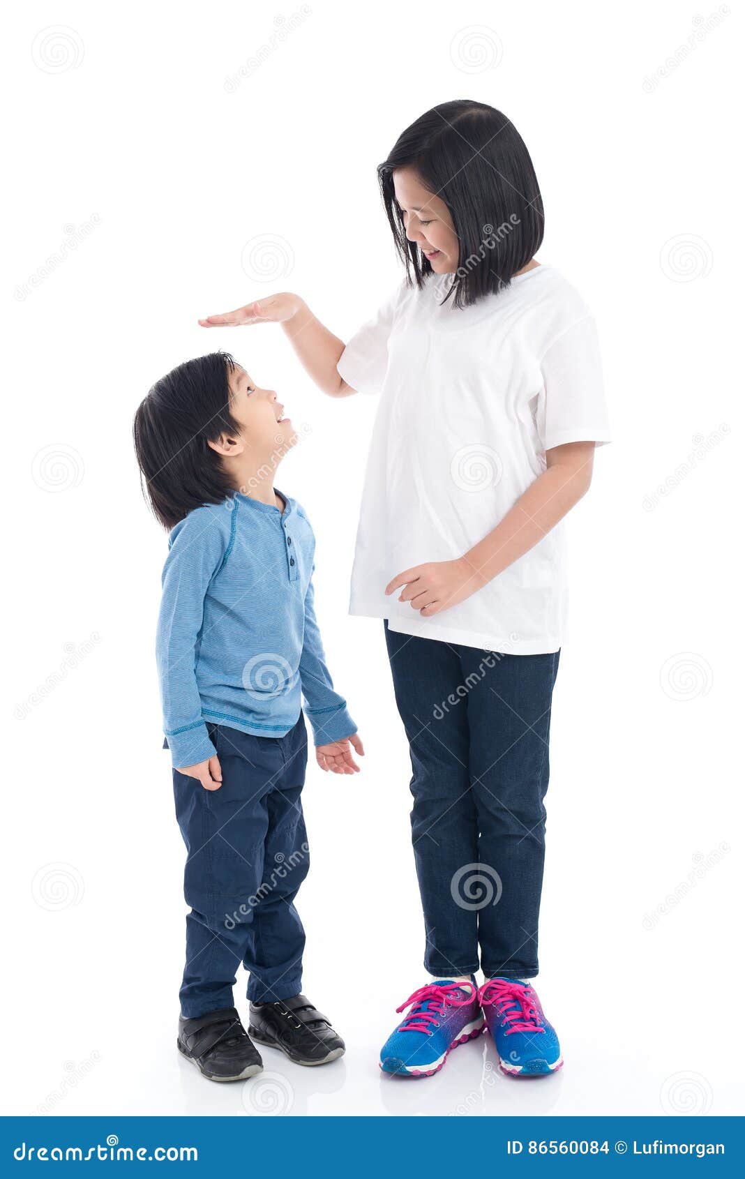 Asiangirl Measures the Growth of Her Brother Stock Photo - Image of ...