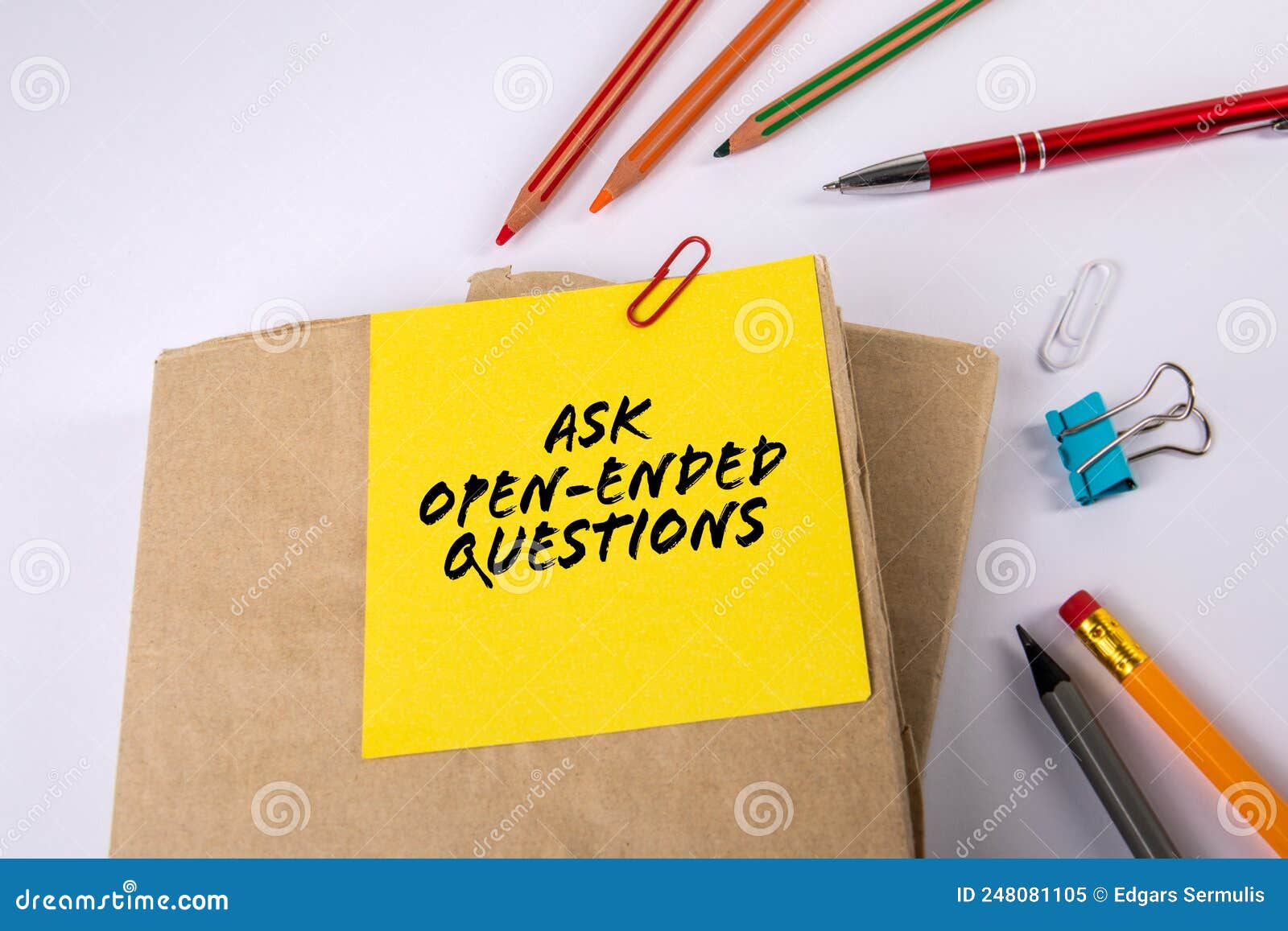 ASK OPEN-ENDED QUESTIONS. Stack of Books on a White Office Desk Stock ...