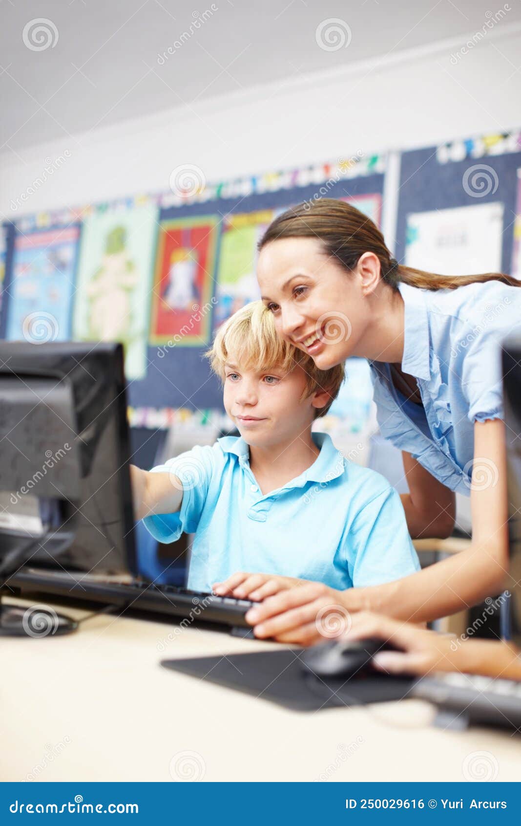 Asking Questions in Computer Class. an Attractive Young Teacher ...