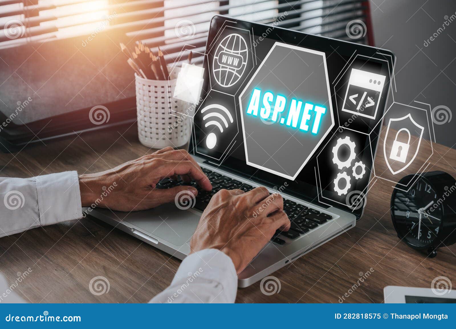 Person Using Laptop Computer with ASP.NET Icon on Virtual Screen Stock ...