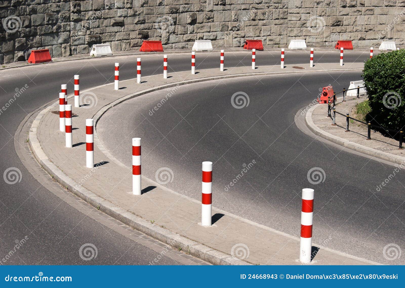 Asphalt Bend and Metal Posts Stock Image - Image of shadow, shade: 24668943