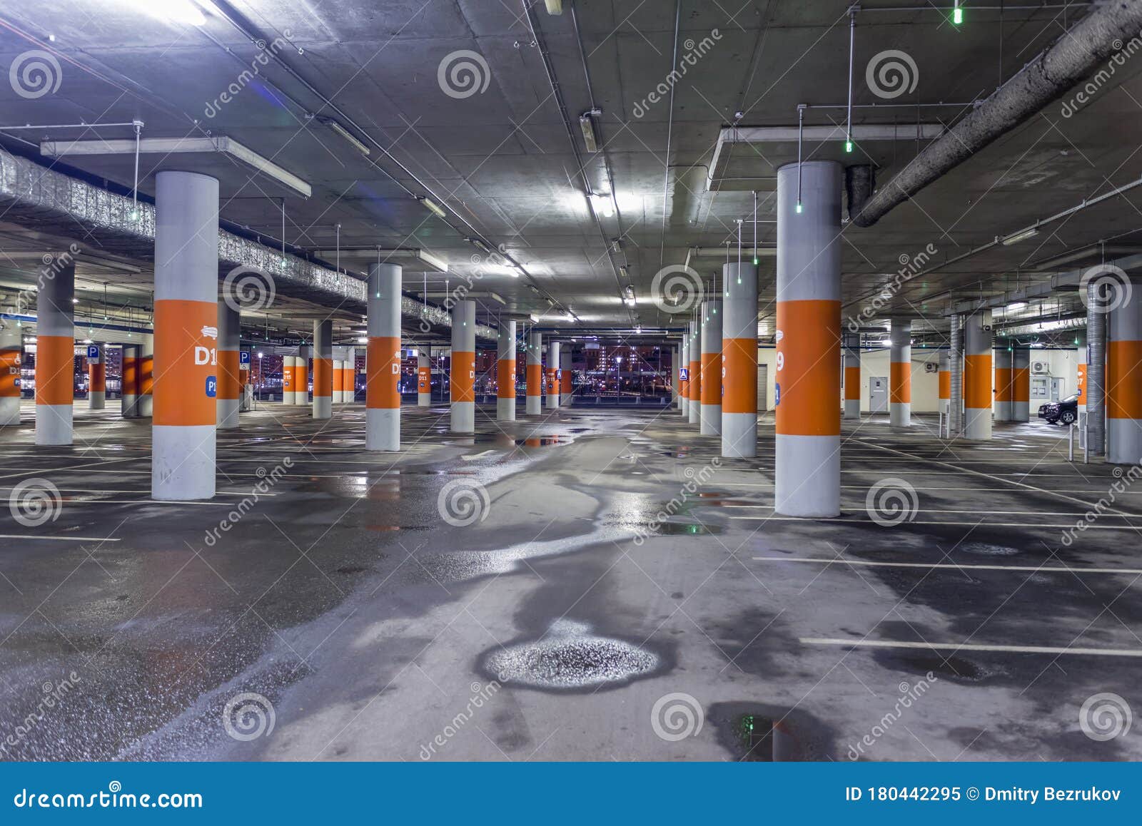 Asphalt, Dimly Lit Empty Mall Garage with Ceiling Lights Editorial ...