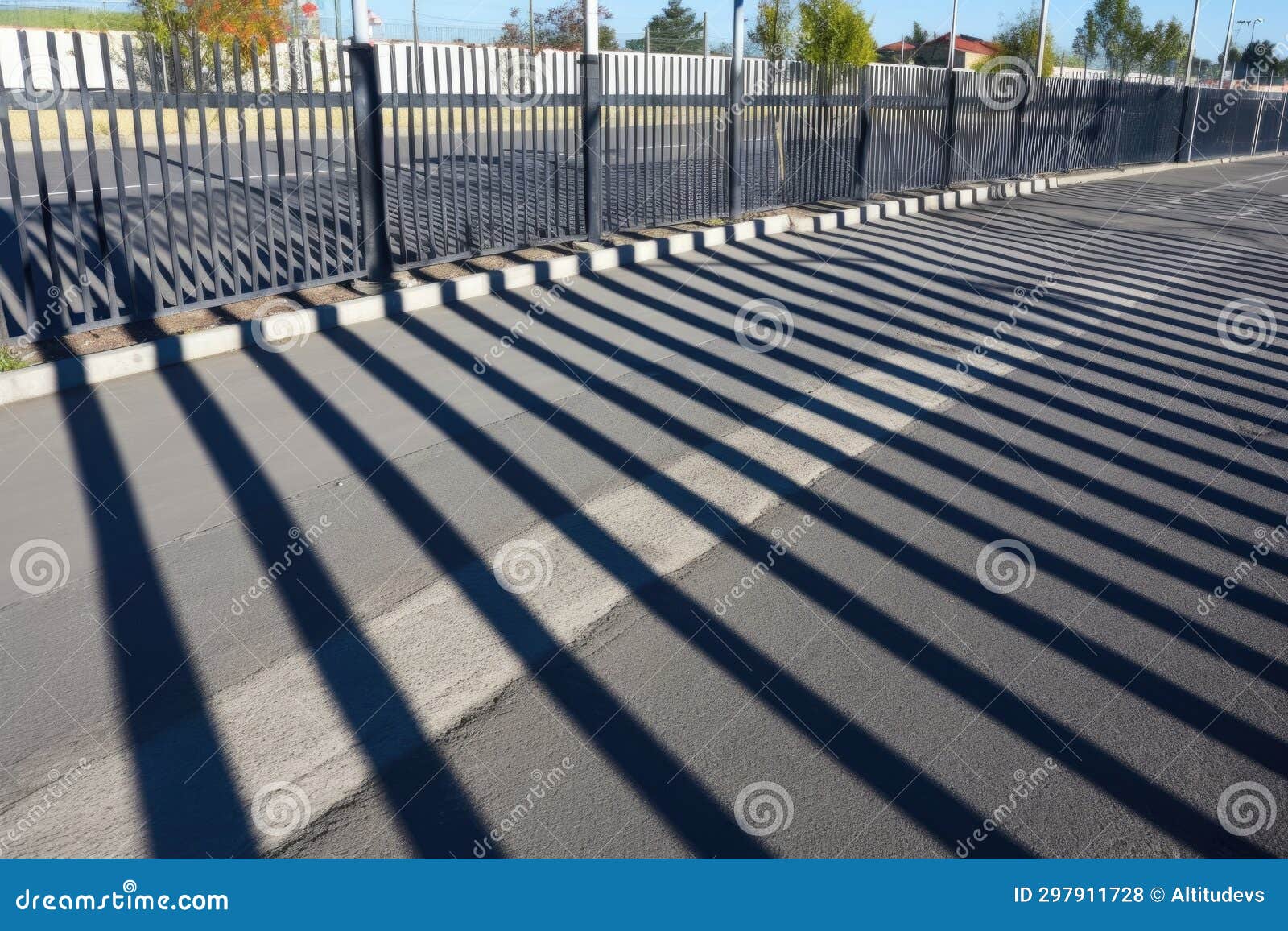 Asphalt with Overlapping Shadows of a Metallic Fence Stock Photo ...