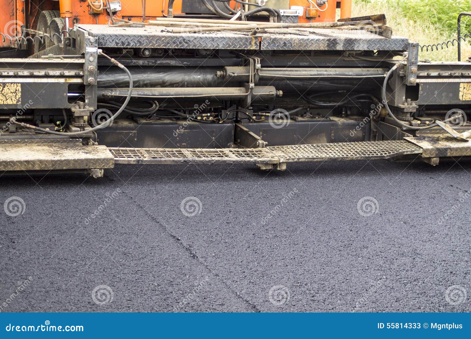Asphalt paver in action stock image. Image of machine - 55814333