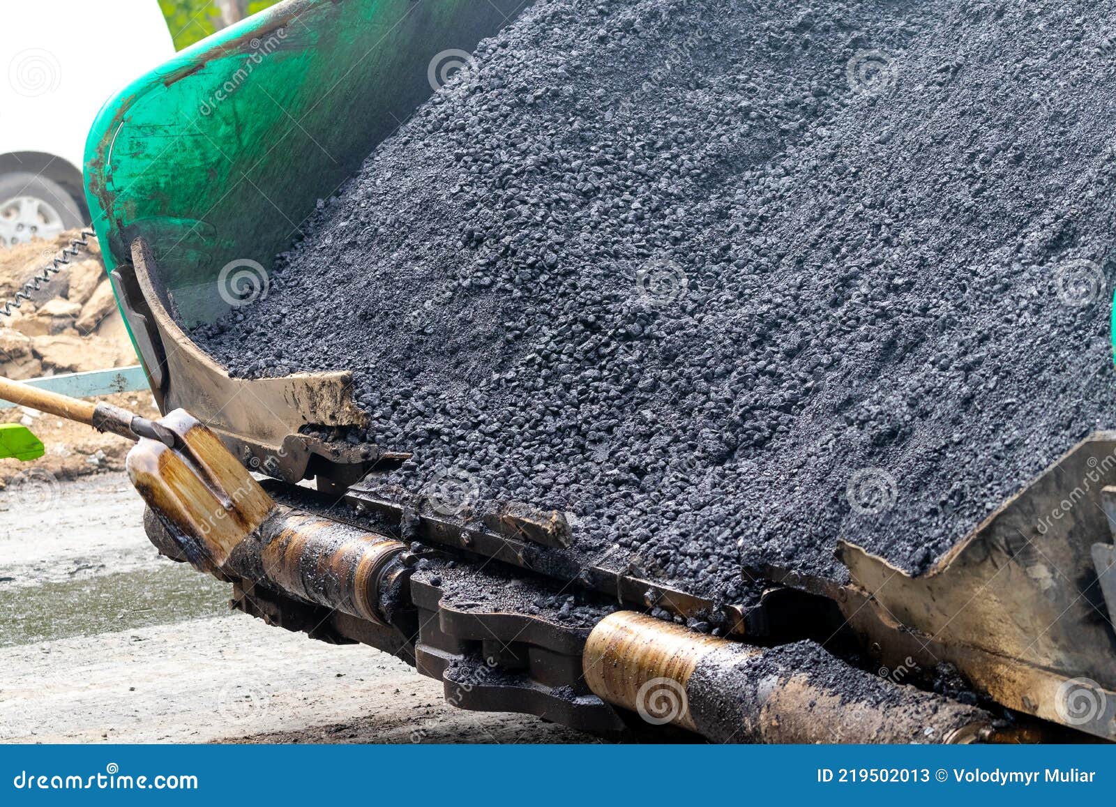 Asphalt in the Asphalt Paver Bucket during Road Construction. Road ...