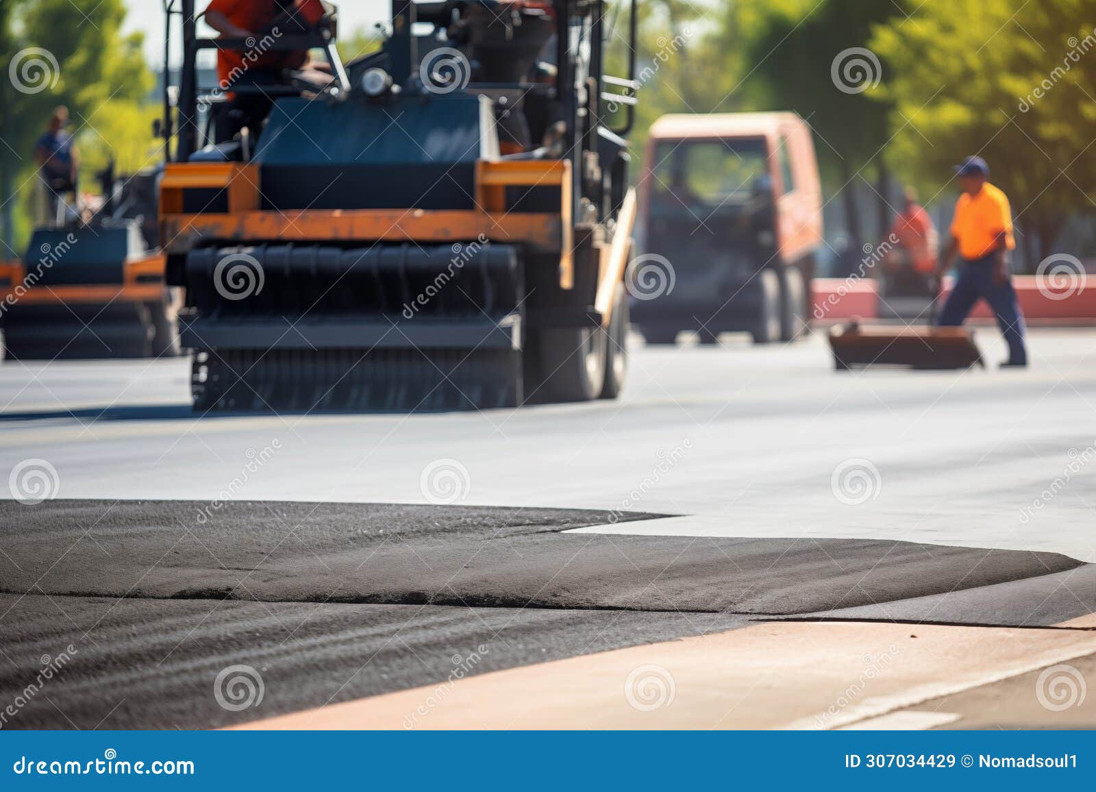 Asphalt Paver Laying Down Fresh Asphalt On A Road, With Workers ...