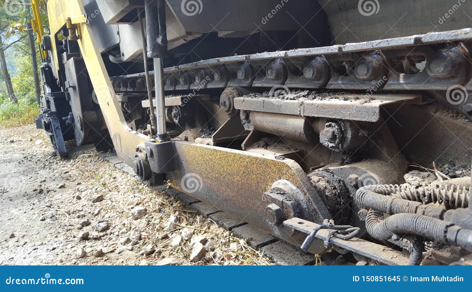 Asphalt Paving Works. Chain on the Side of Asphalt Paver Stock Image ...