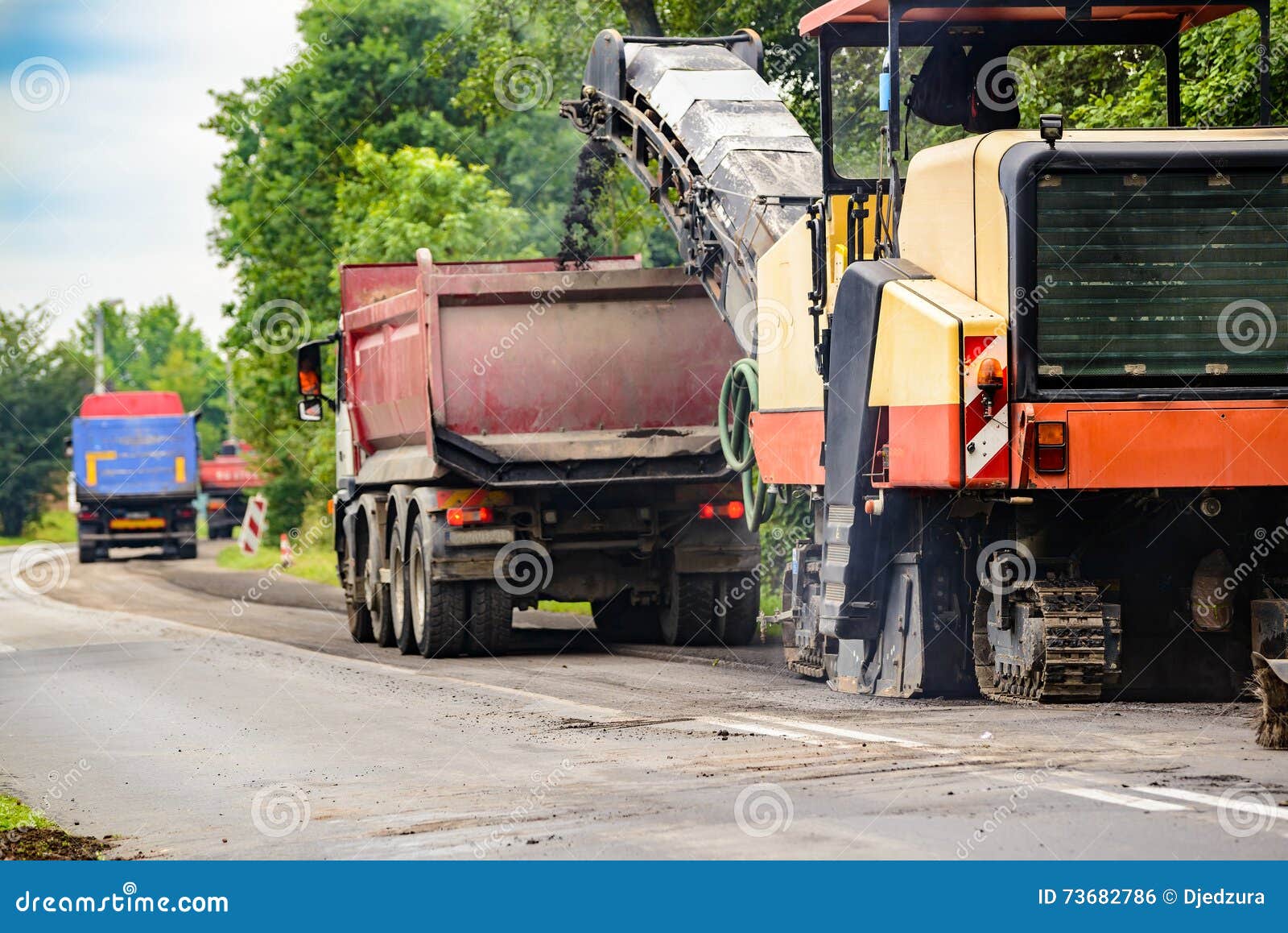 Asphalt Removing Machine Loading Powdered Asphalt on the Truck Stock ...