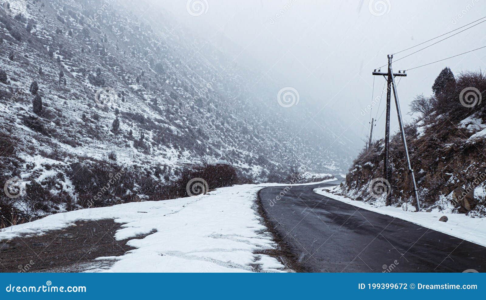 Asphalt Road Cutting Trough Mountains Covered with Snow Stock Photo ...