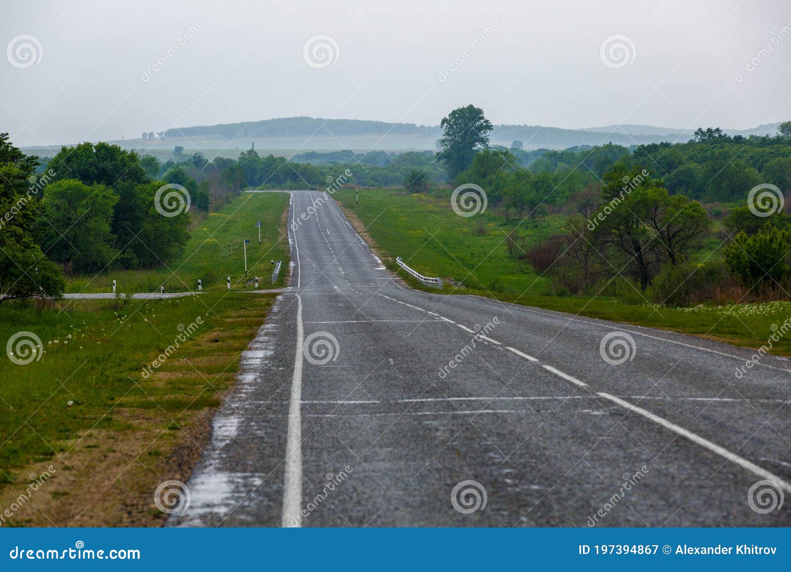 Asphalt Road Receding into the Distance among Green Fields Stock Image ...