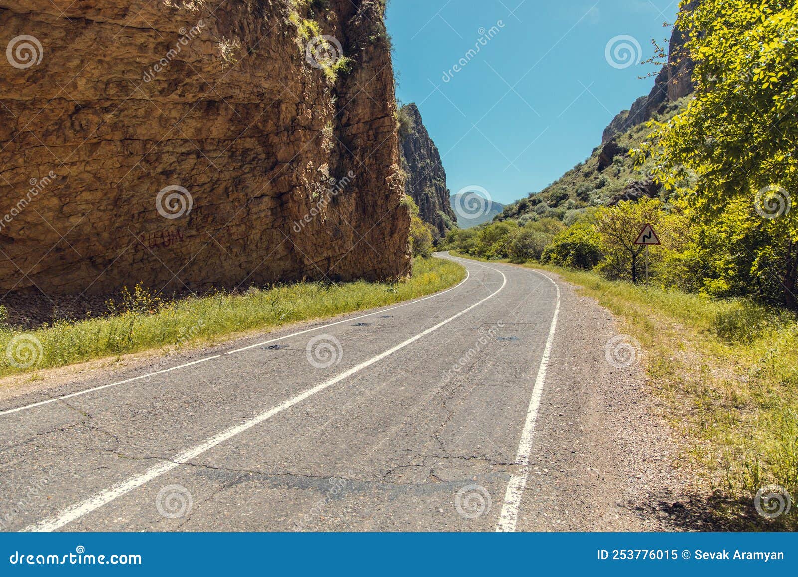 Asphalt road and rocks stock image. Image of roadway - 253776015