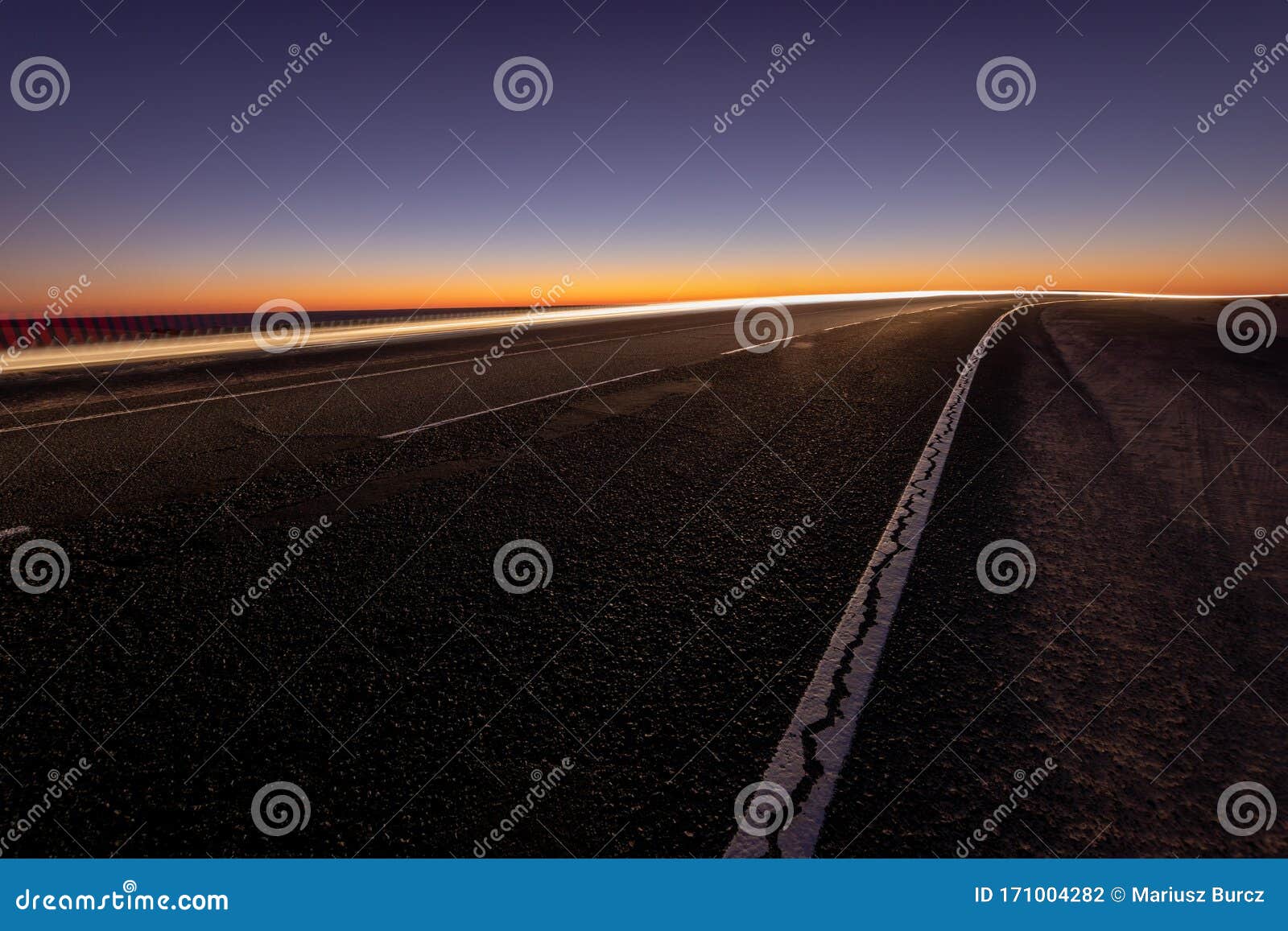 Asphalt Road Running through the Sandy Desert at Night Stock Photo ...