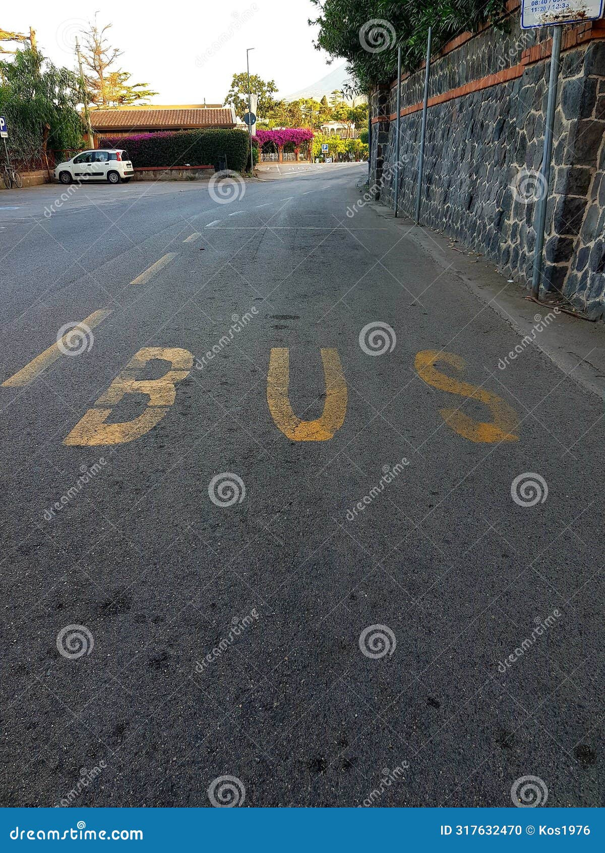 Asphalt Road with the Word Bus Written in Yellow on the Road Stock ...