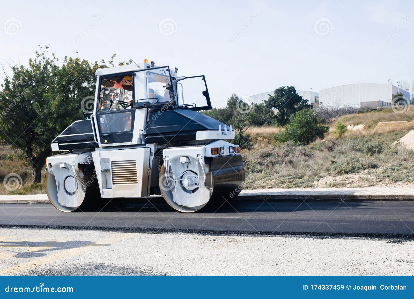 Asphalt Roller Compactor Machine Working on the Paving of a Road Stock ...