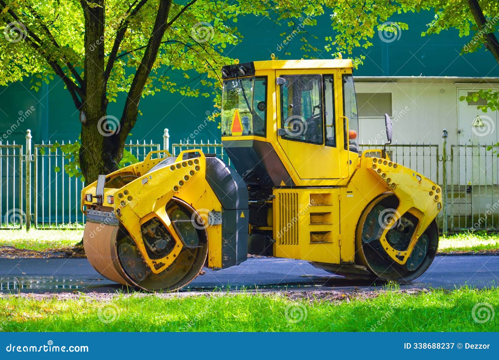 Asphalt Roller Working on Pavement of a Road in the City. Stock Image ...
