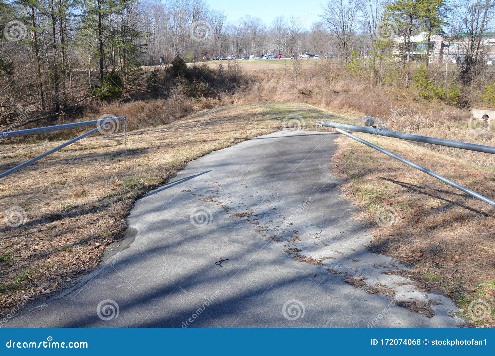 Asphalt Trail or Path and Metal Bars Stock Photo - Image of pavement ...