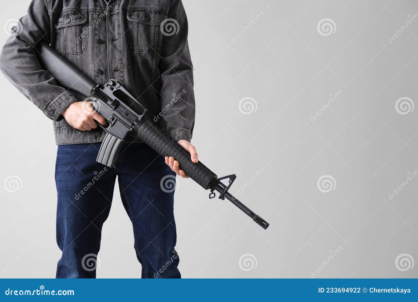 Assault Gun. Man Holding Rifle on Light Background, Closeup. Space for ... Assault Gun. Man Holding Rifle on Light Background, Closeup. Space for ...