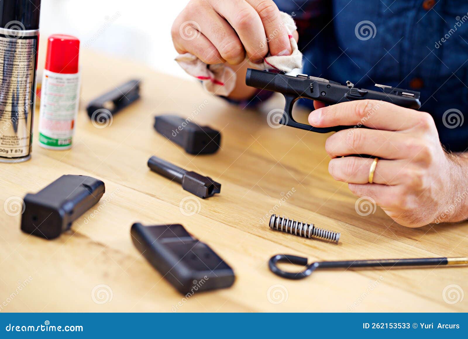 Assemble As Quickly As Possible. Cropped View of a Man Cleaning His Gun ...