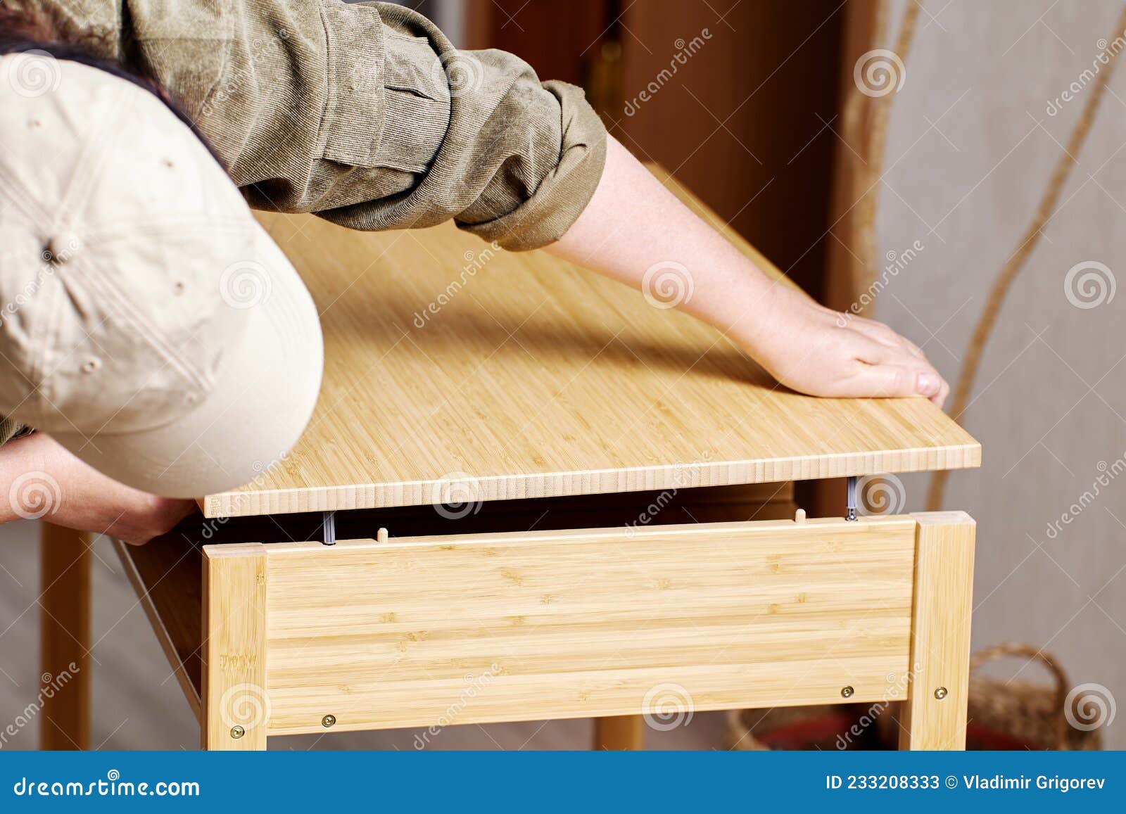 Assembler Is Installing Flat Pack Furniture At Home Stock Image