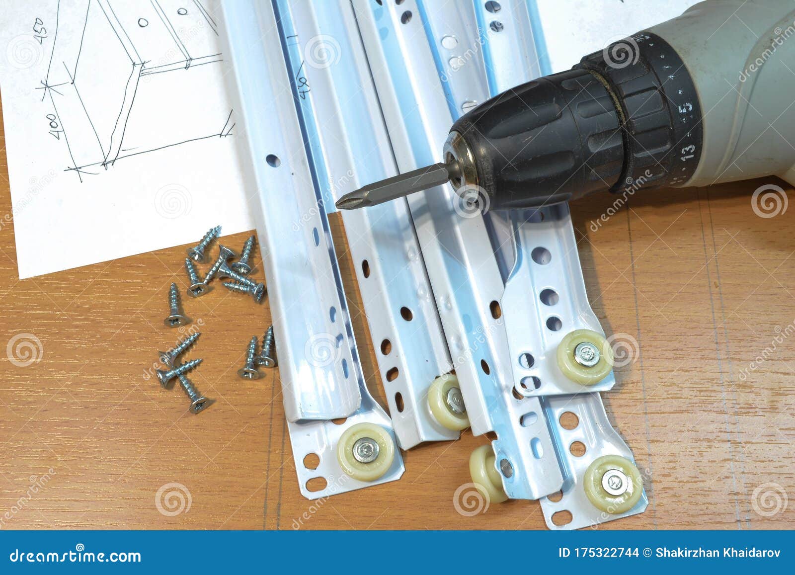 Assembling Bedside Tables According To the Drawing Stock Photo - Image ...