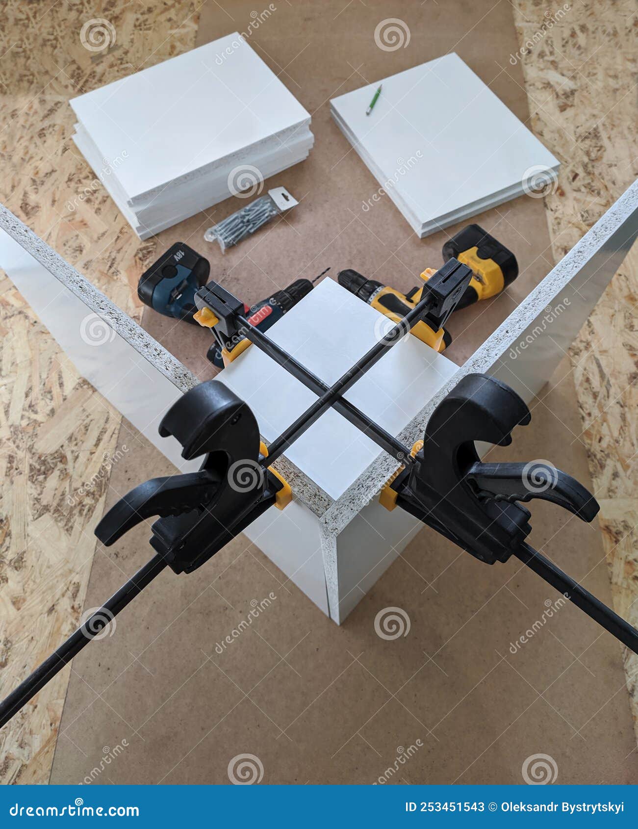 Assembling Cabinet Furniture from Laminated Chipboard Stock Image ...