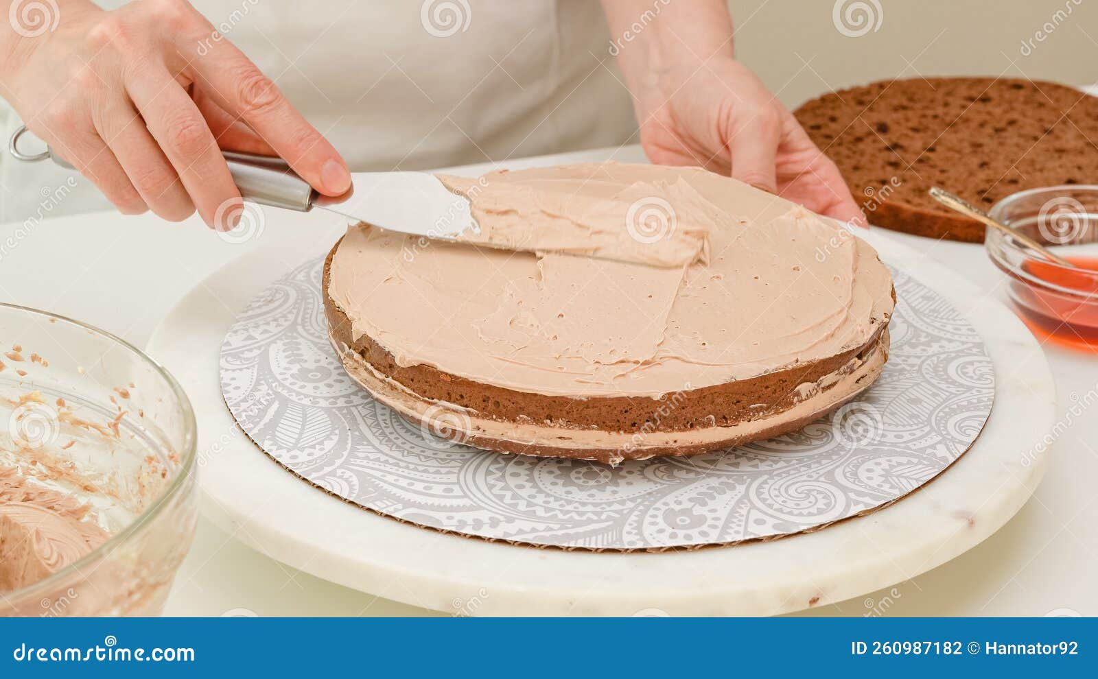 Assembling the Cake. Woman Hands Topping Part of the Cake with ...