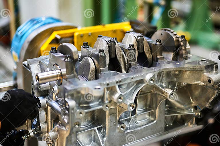 Assembling Car Engine by Worker Hand in Workshop Closeup Stock Photo ...