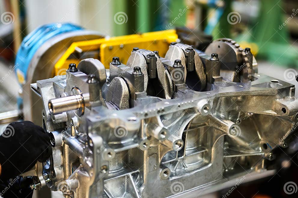 Assembling Car Engine by Worker Hand in Workshop Closeup Stock Photo ...