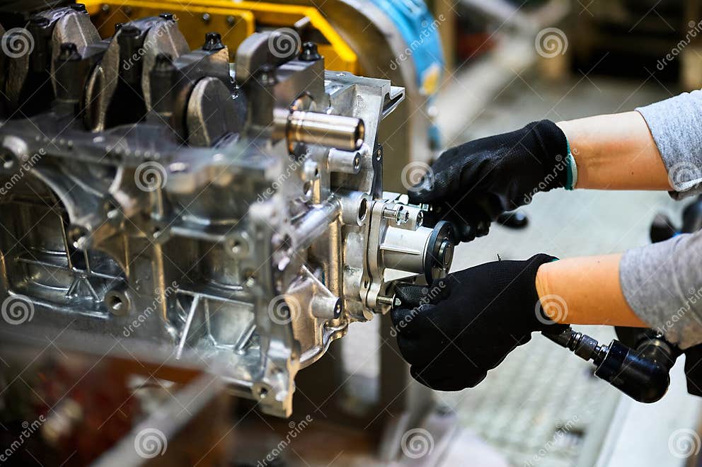 Assembling Car Engine by Worker Hand in Workshop Closeup Stock Image ...