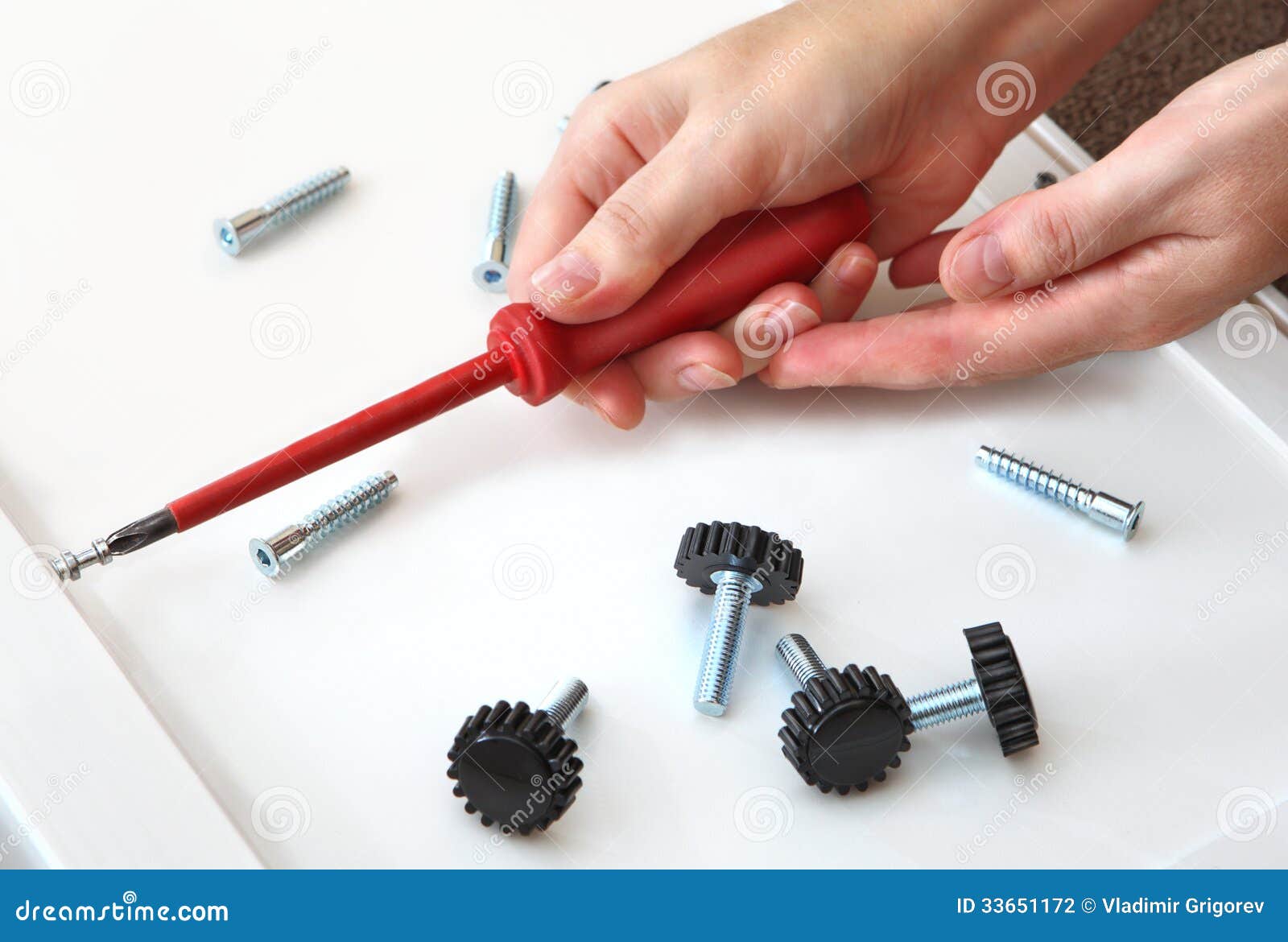 Assembling Furniture, Hand with Screwdriver, Adjustable Plastic Stock ...