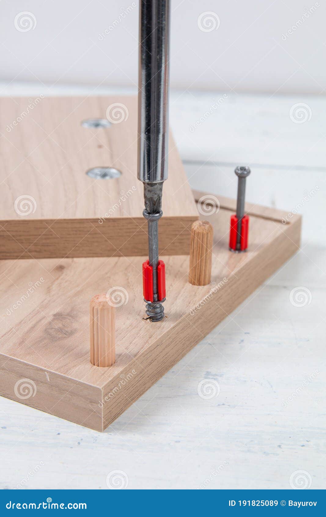 Assembling Furniture Using a Screwdriver. Furniture Assembly Stock ...