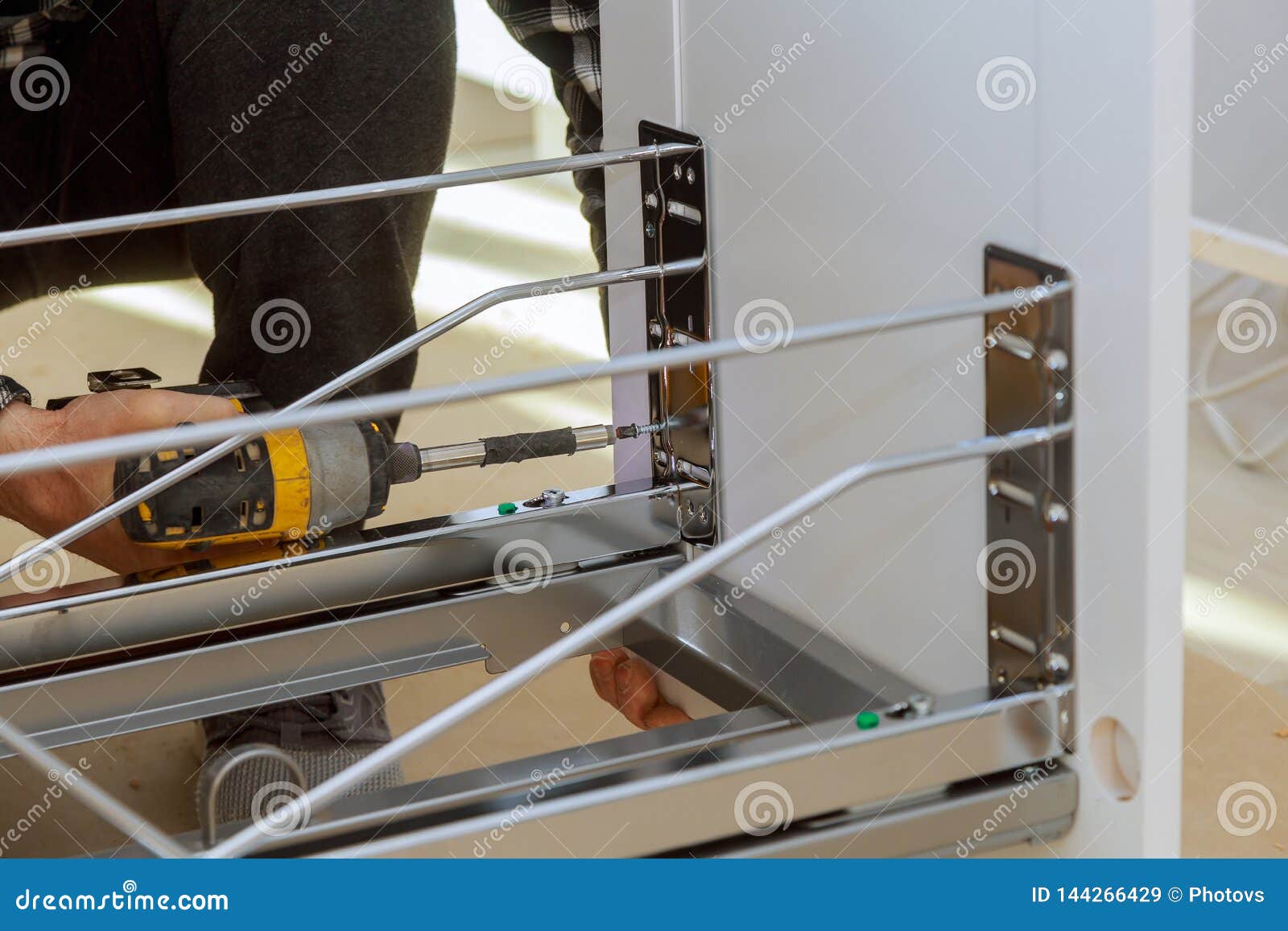 Assembling Furniture Woodworker Screwing Using a Cordless Screwdriver ...