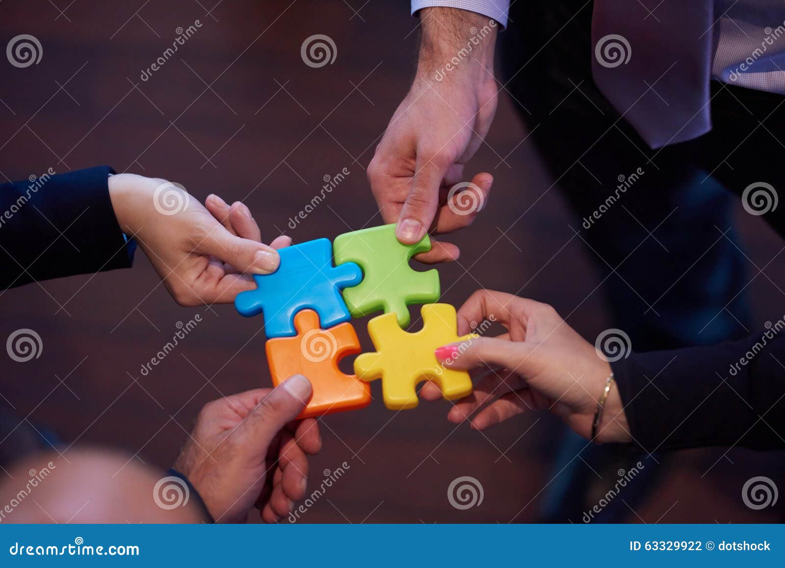Assembling jigsaw puzzle stock photo. Image of family - 63329922