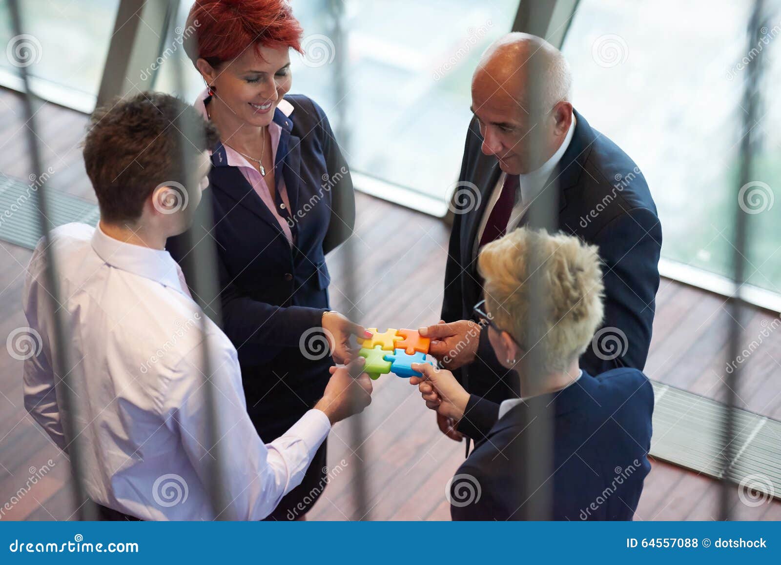 Assembling jigsaw puzzle stock photo. Image of male, cooperation - 64557088