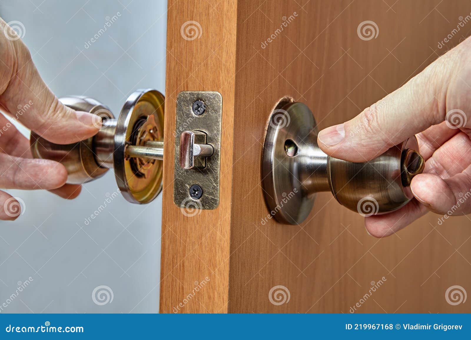Assembling Lock with Door Knobs and Latch in Living Room. Stock Photo ...