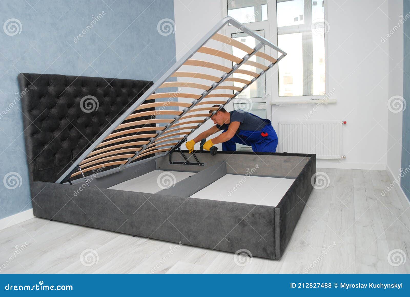 Assembling a new bed stock photo. Image of assembling - 212827488