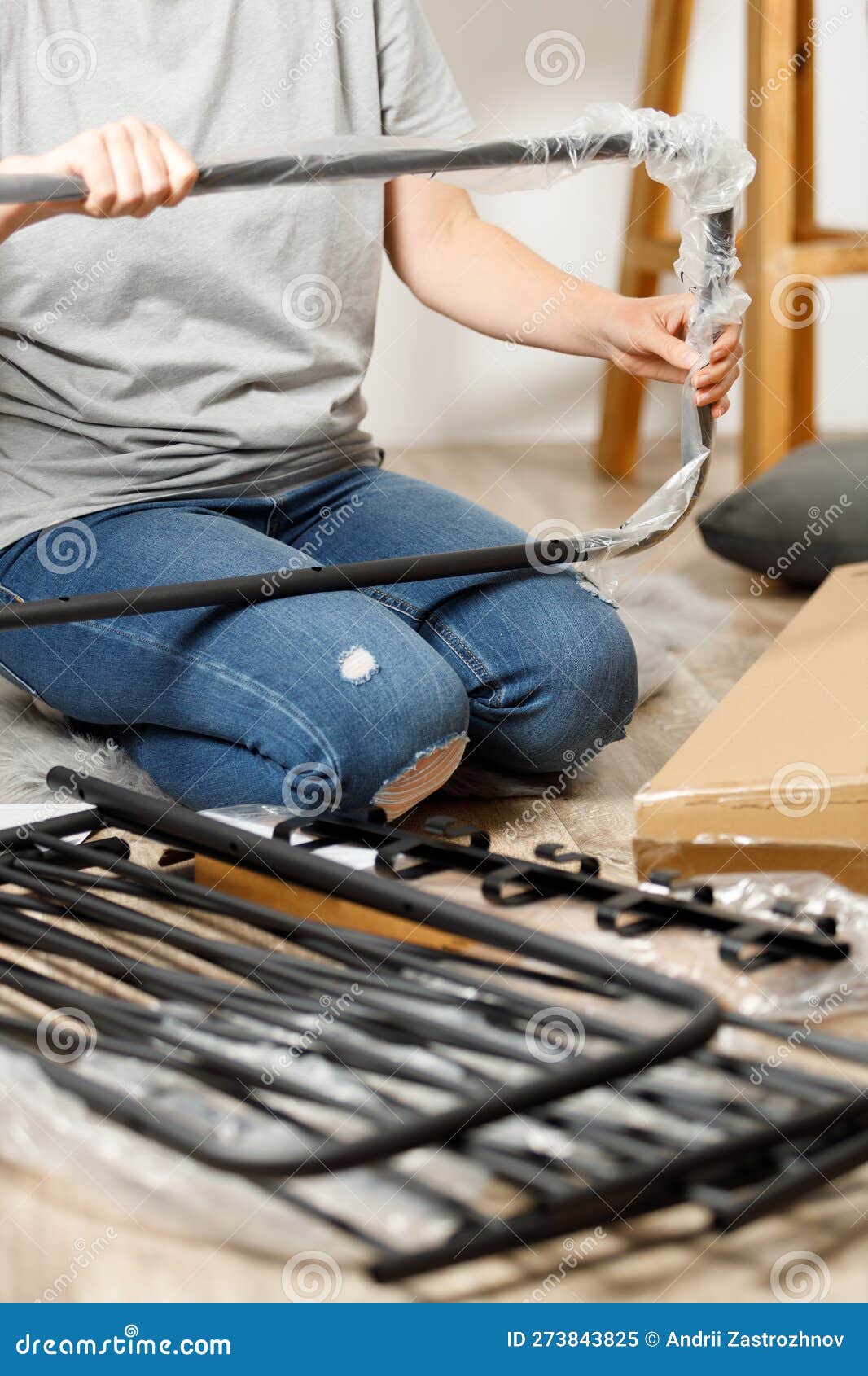 Assembling New Furniture from a Box in a Home Interior, Vertically ...