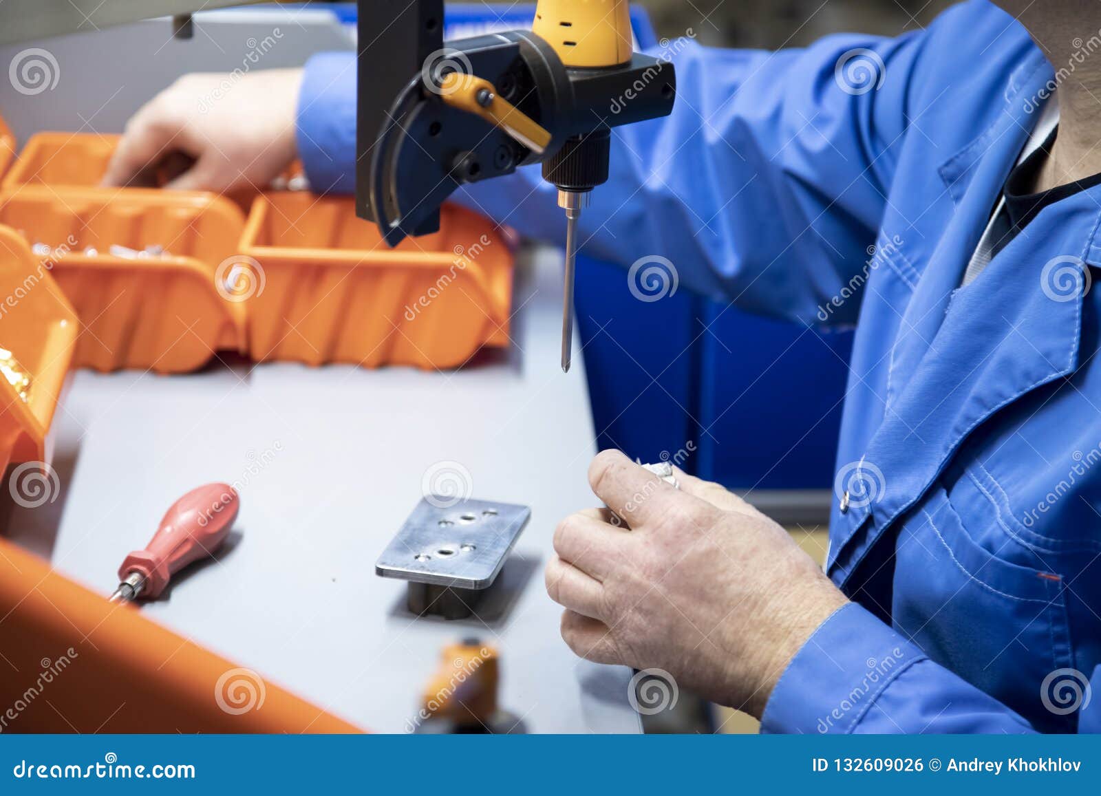 Assembling the Product by a Person with a Disability. Stock Photo ...