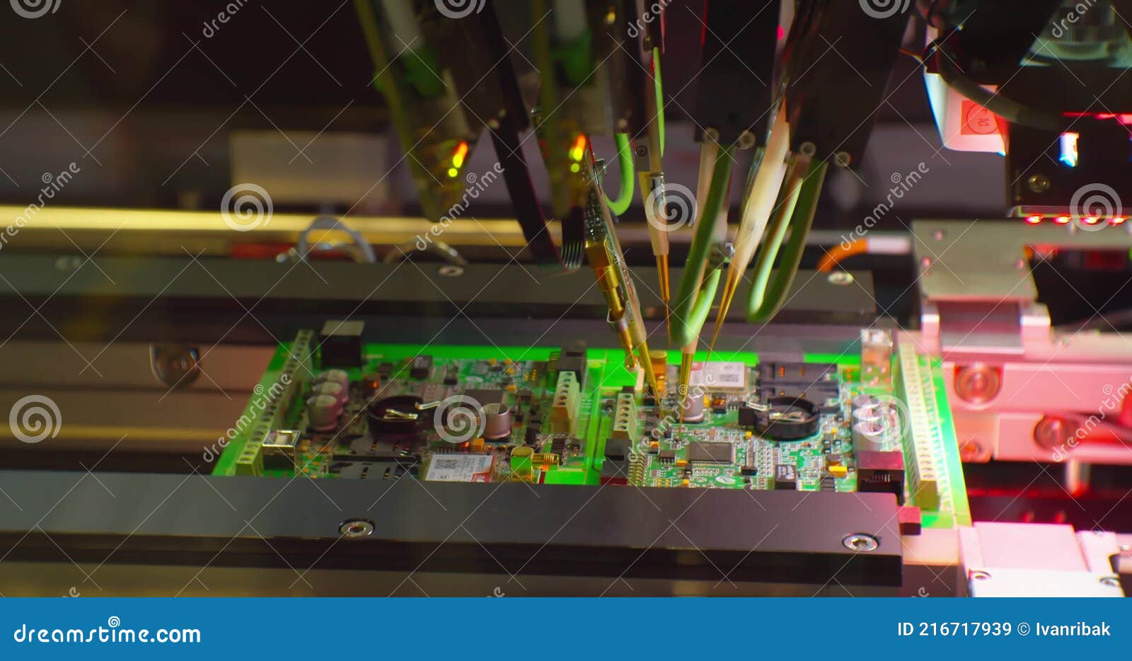 Assembly of a Complex Electronic Board by an Industrial Robot.Cose-up ...