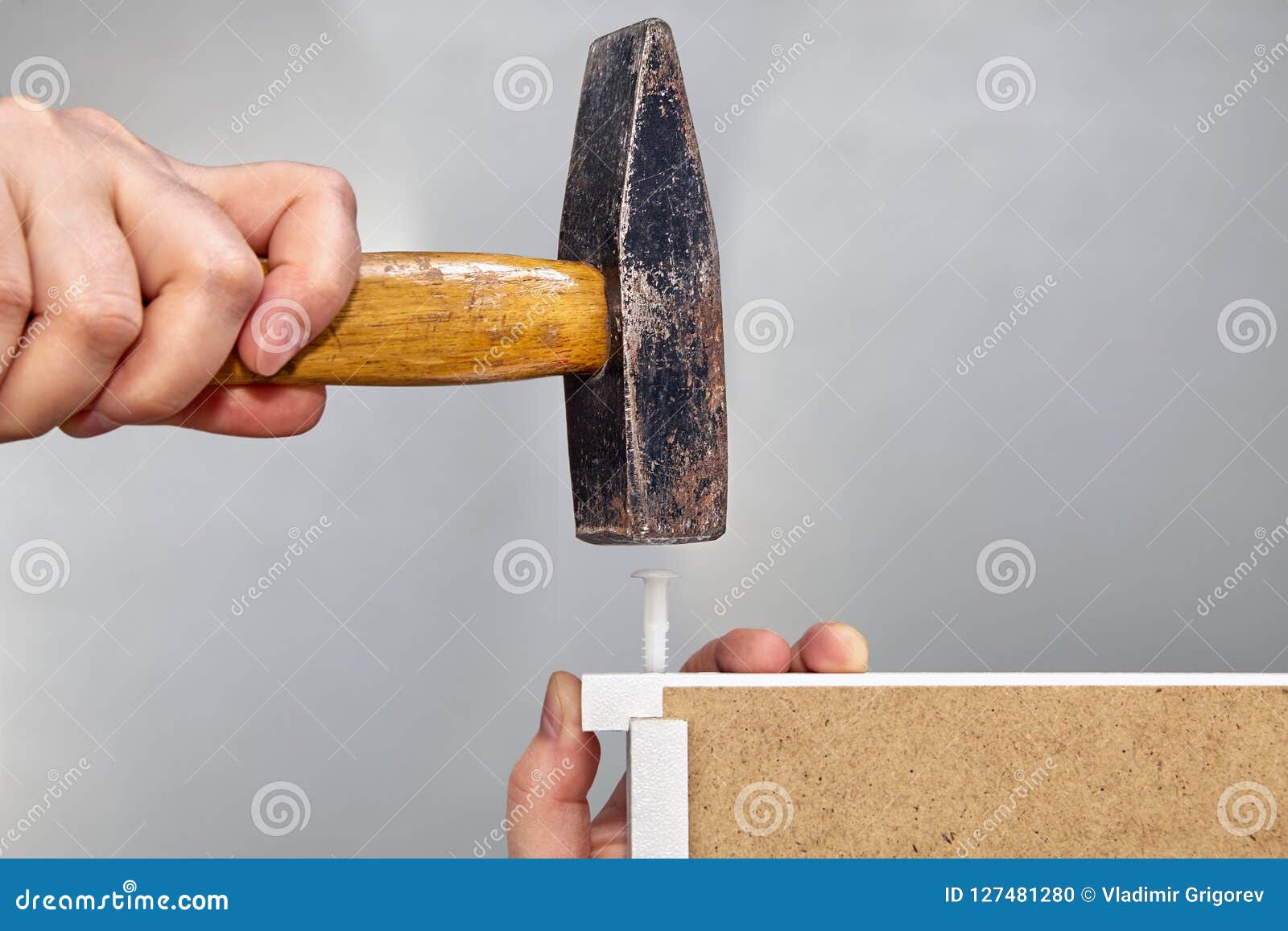 Installation of Drawer Using Plastic Dowel Pin and Hammer. Stock Photo ...