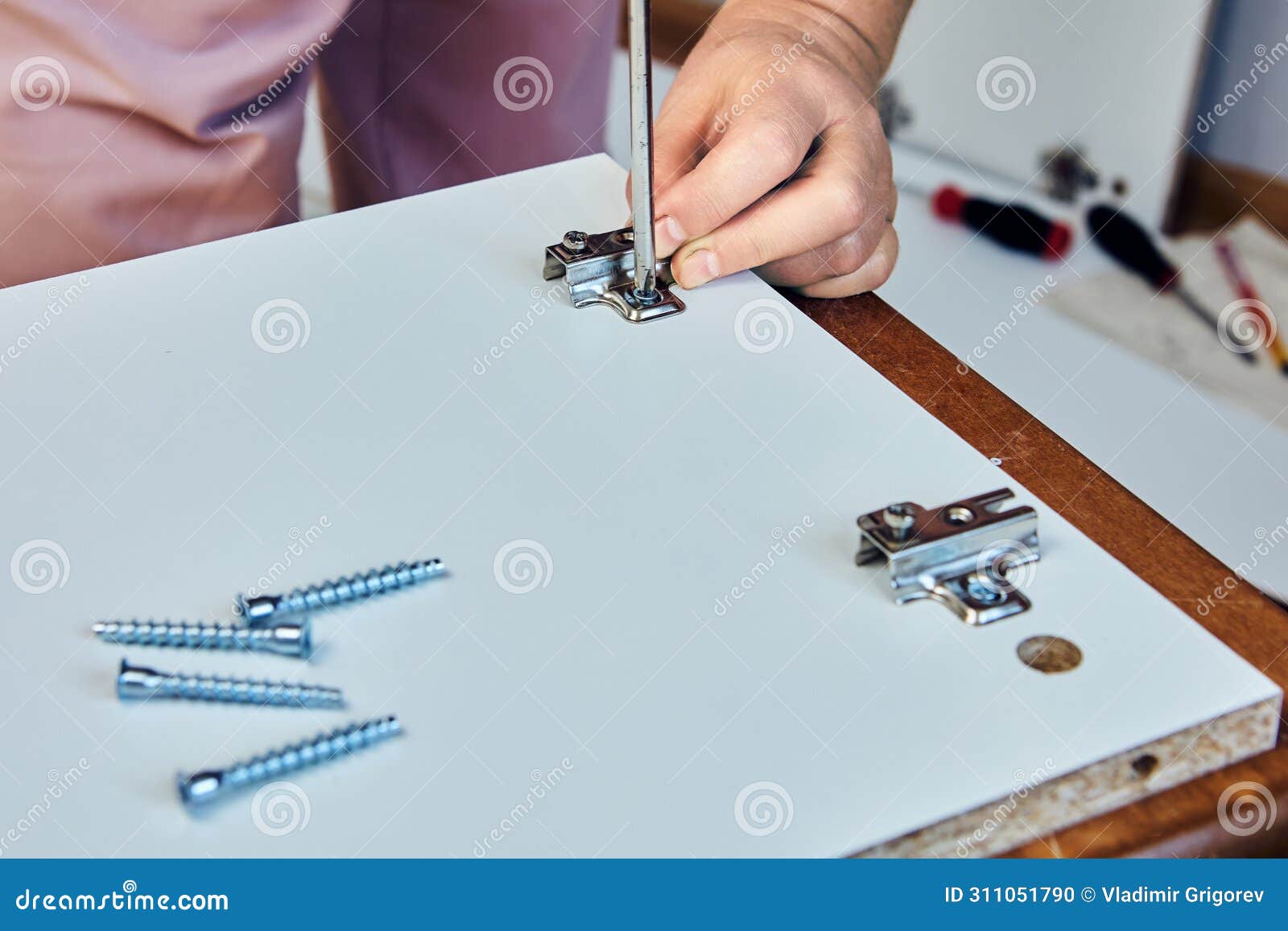 Flat Pack Furniture, Assembling Laminated Particle Board Cabinet ...